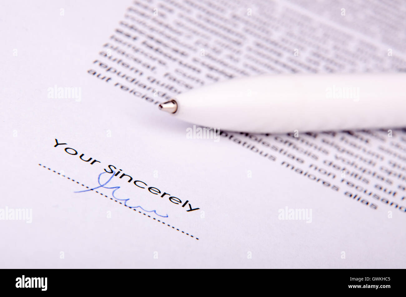 Signature over agreement Stock Photo - Alamy