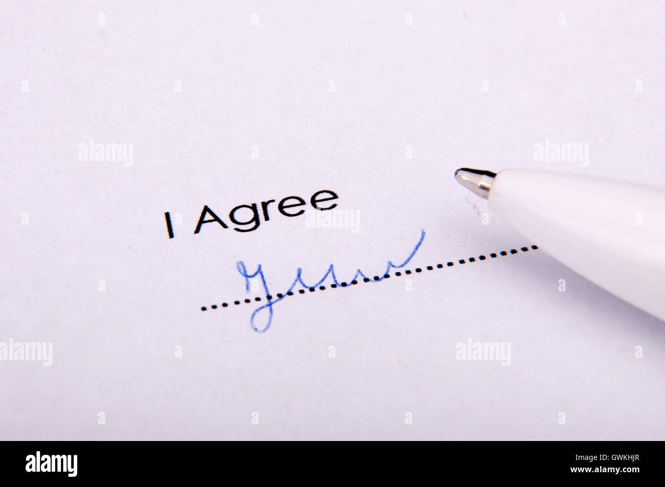 Signature over agreement Stock Photo - Alamy