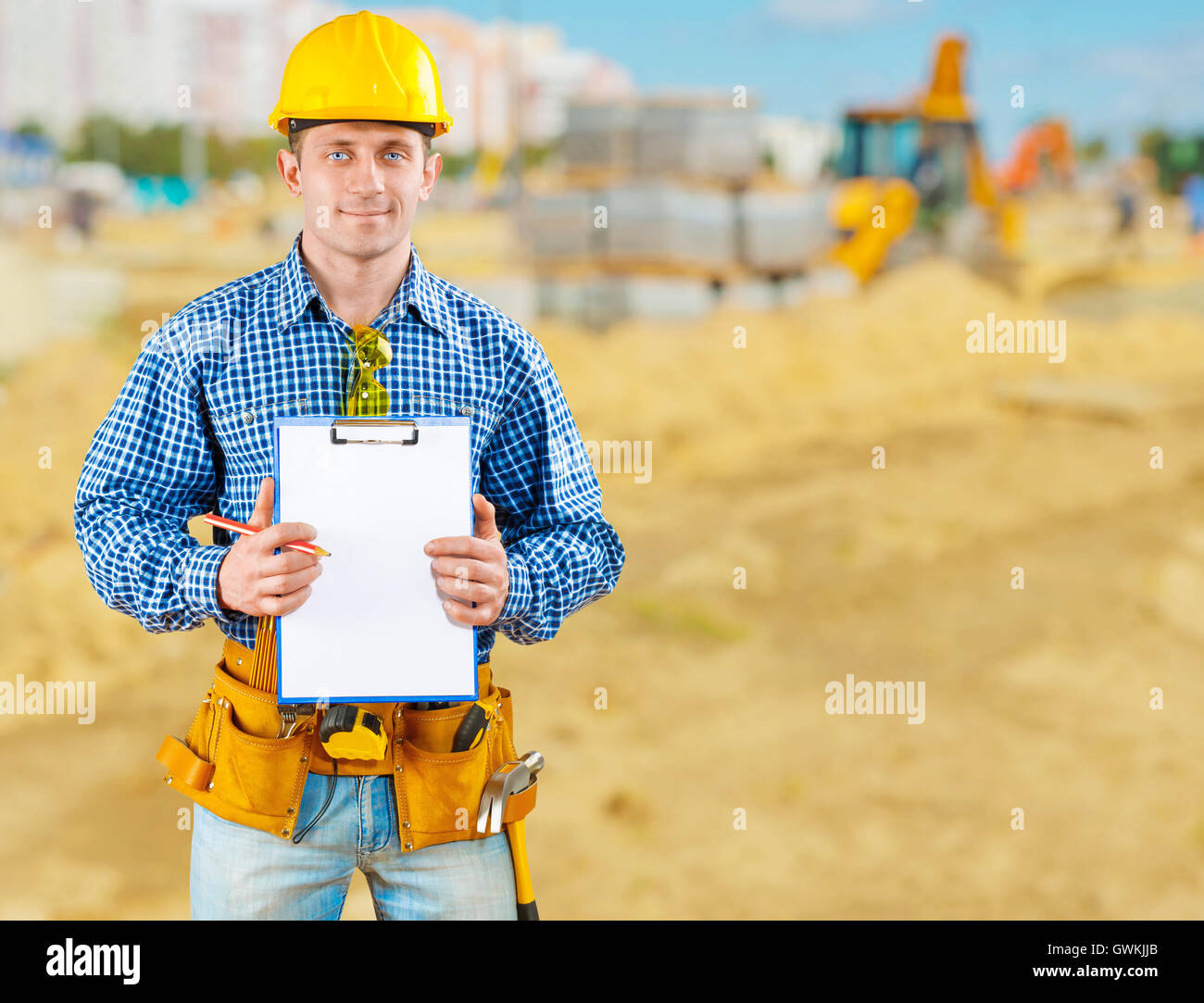 contractor on road construction with clipboard Stock Photo - Alamy