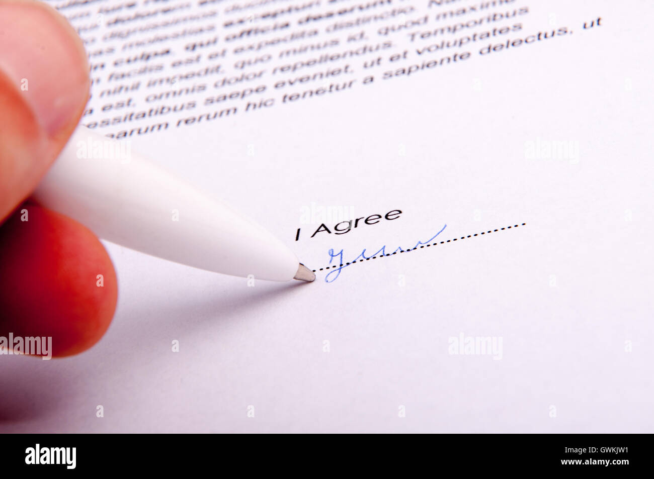 Signature over agreement Stock Photo - Alamy
