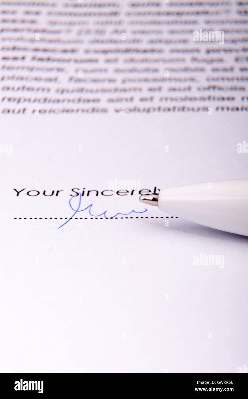 Signature over agreement Stock Photo - Alamy