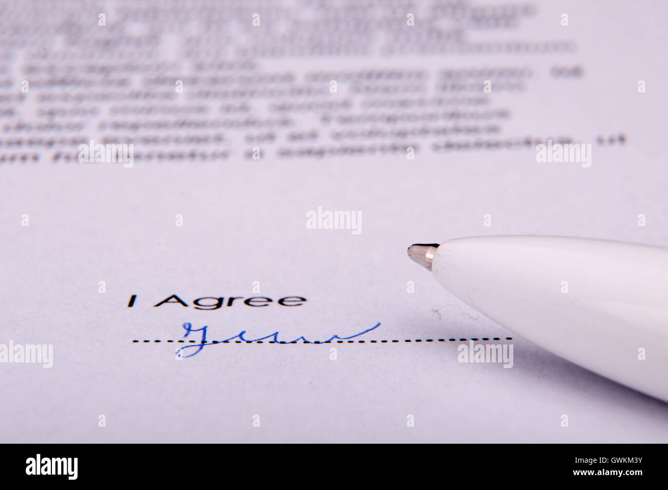 Signature over agreement Stock Photo - Alamy