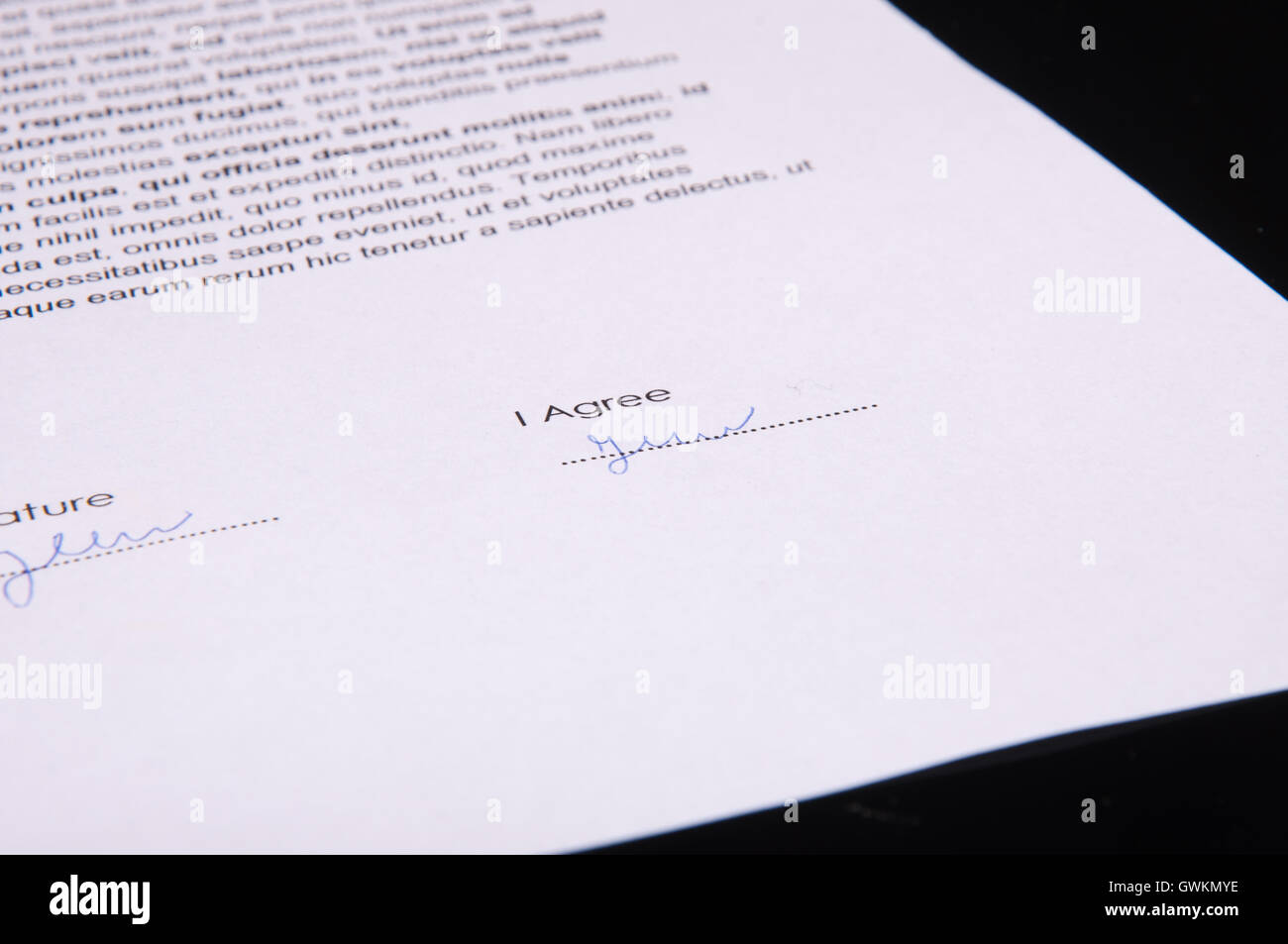 Signature over agreement Stock Photo - Alamy