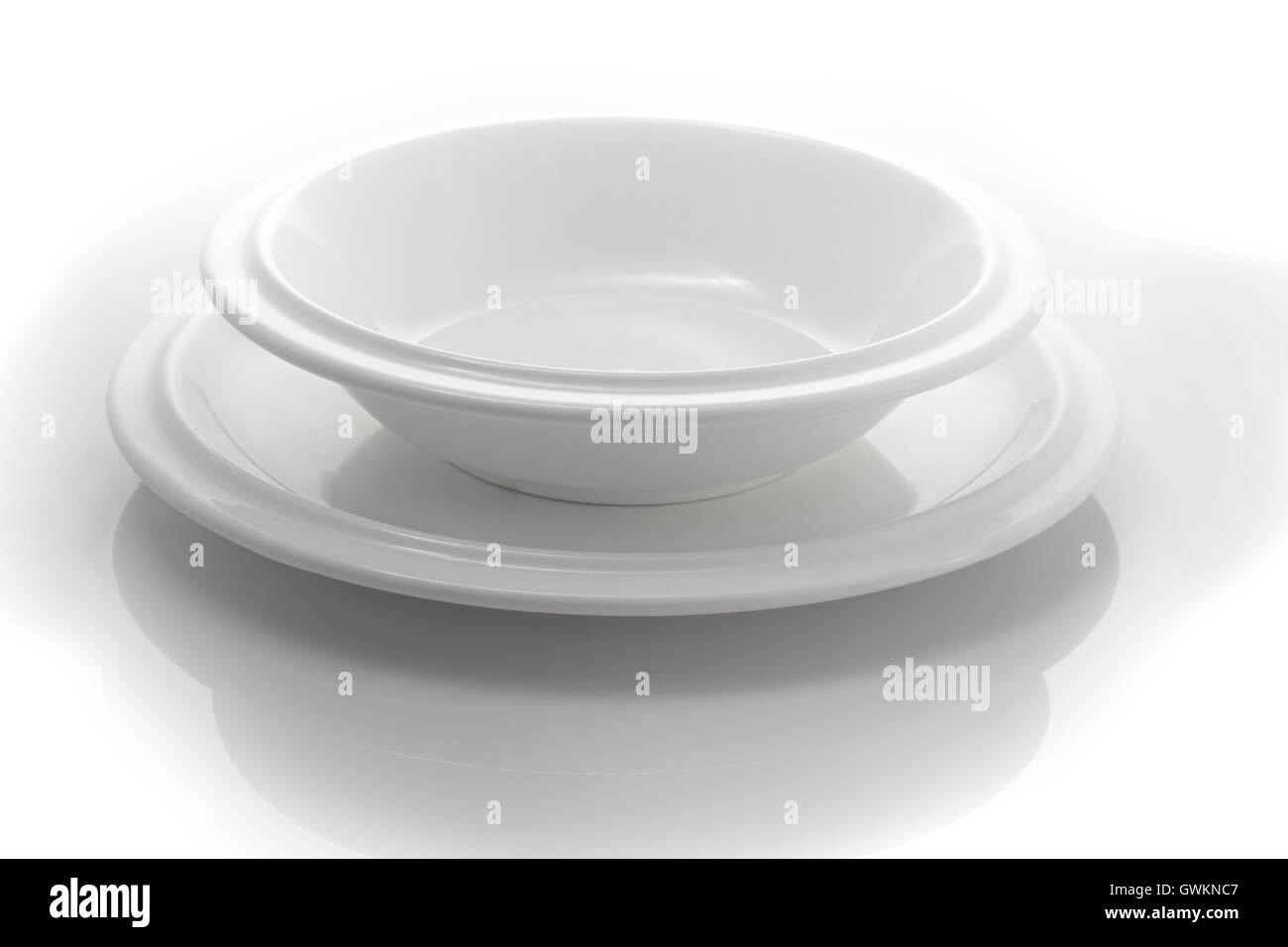 two plates isolated on a white background Stock Photo - Alamy
