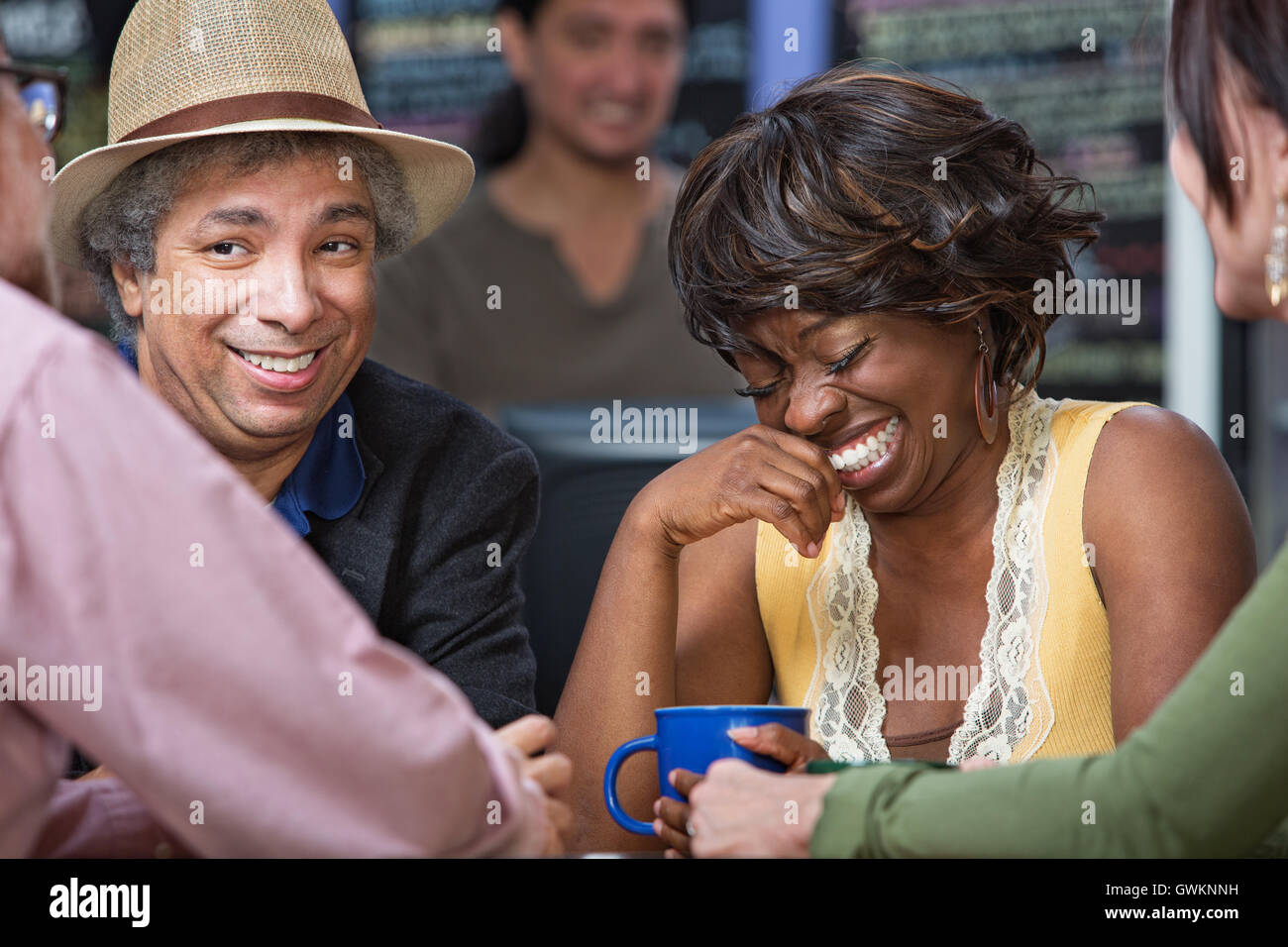 Woman Giggling with Friends Stock Photo - Alamy