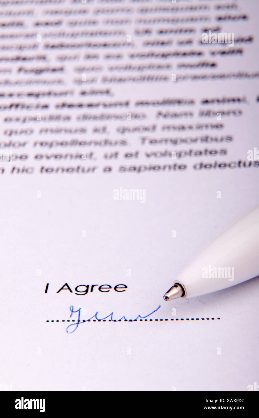 Signature over agreement Stock Photo - Alamy