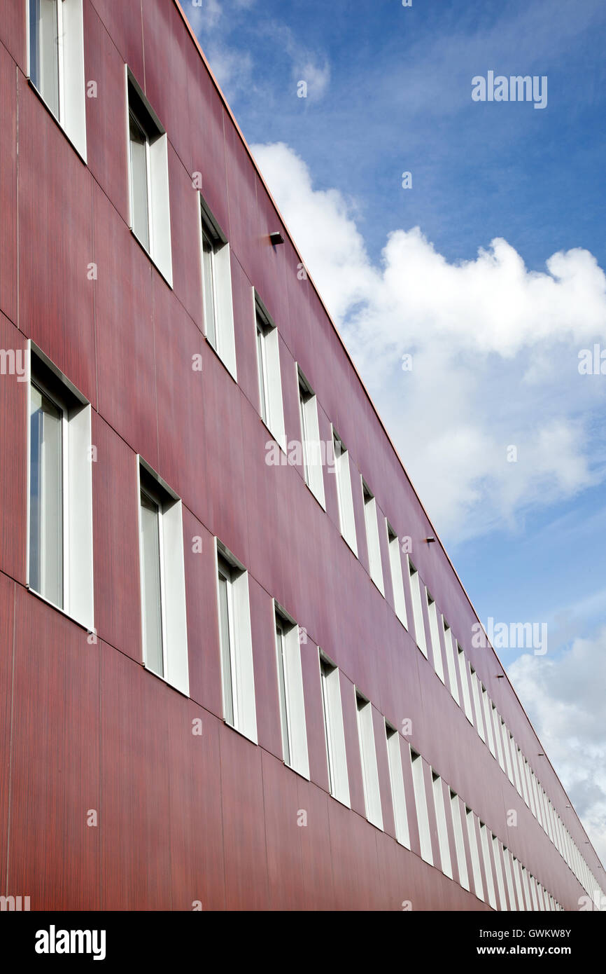 red wall of office building and clouds Stock Photo - Alamy