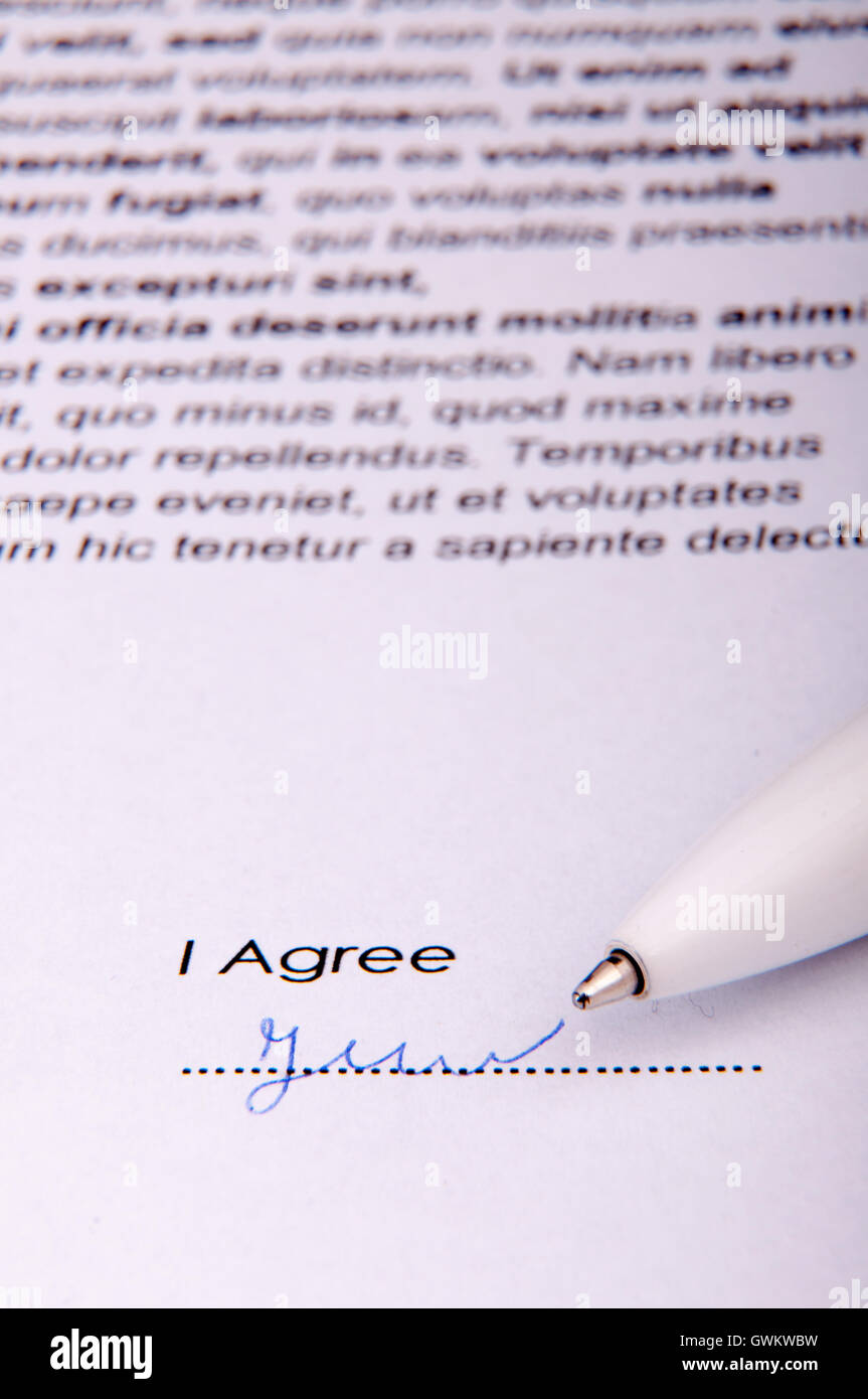 Signature over agreement Stock Photo - Alamy