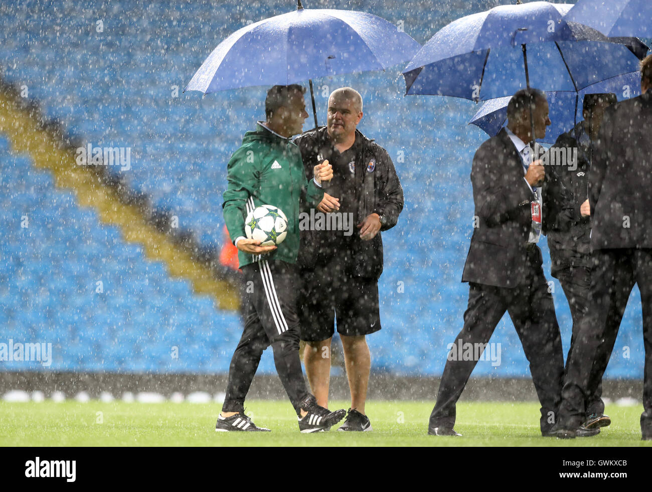 Referee Bjorn Kuipers and head groundsman Lee Jackson inspect the pitch ...