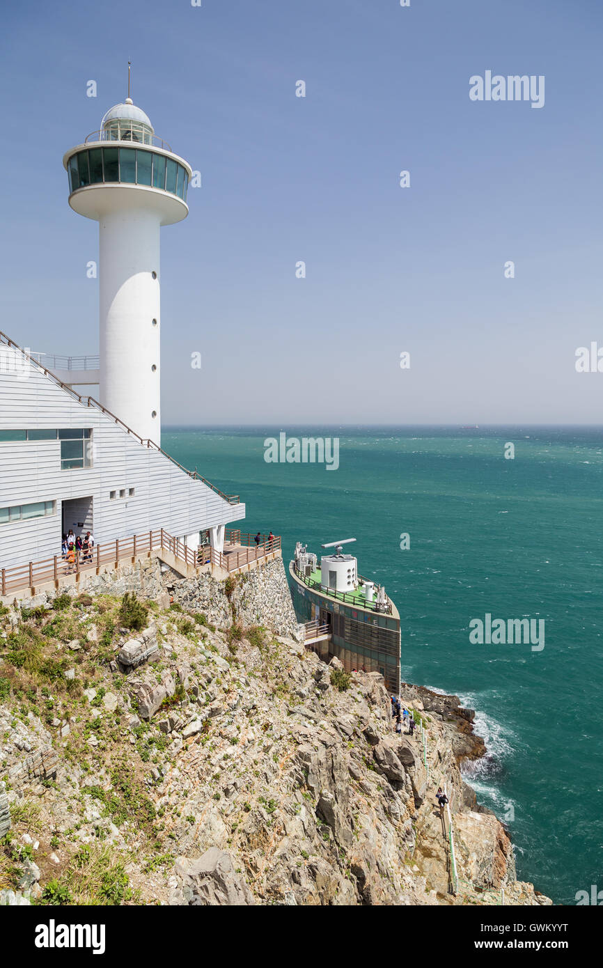 View of people, Yeongdo Lighthouse and steep cliff at the Taejongdae ...