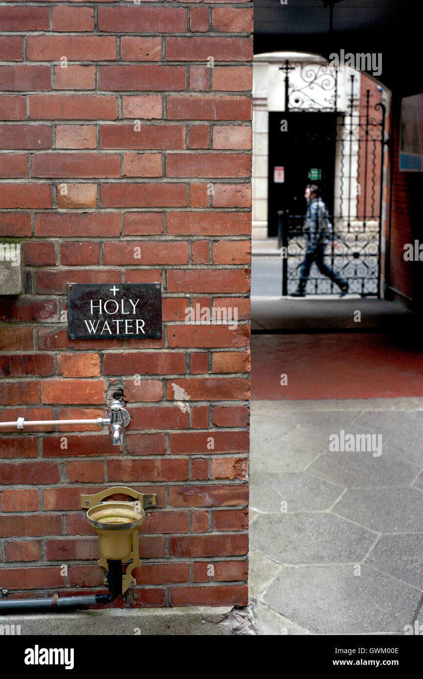 Holy Water sign and tap, St Teresa's church, Dublin, Republic of ...