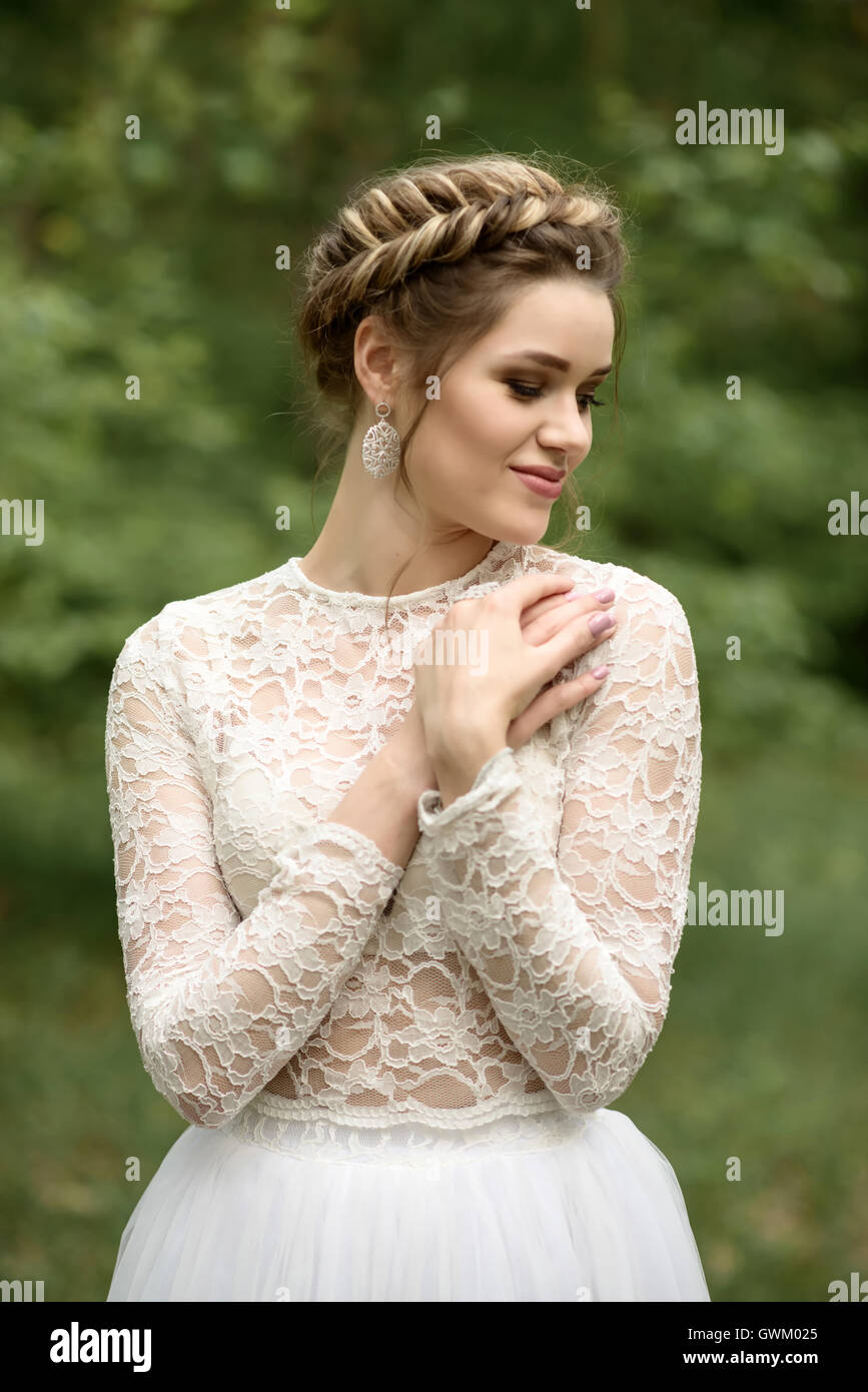Girl in a beautiful white dress. young friendly girl looking. Young ...