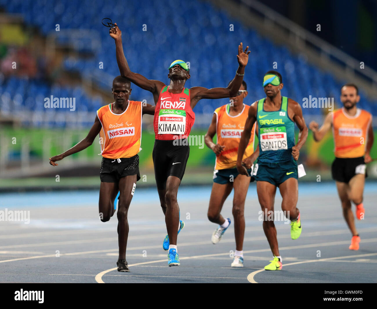Kenya's Samwel Mushai Kimani (second left) with his guide James Boit ...