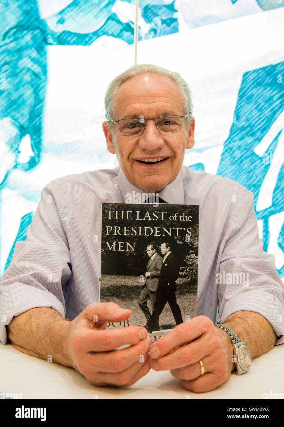 Journalist and author Bob Woodward holds a copy of his recent book, The ...