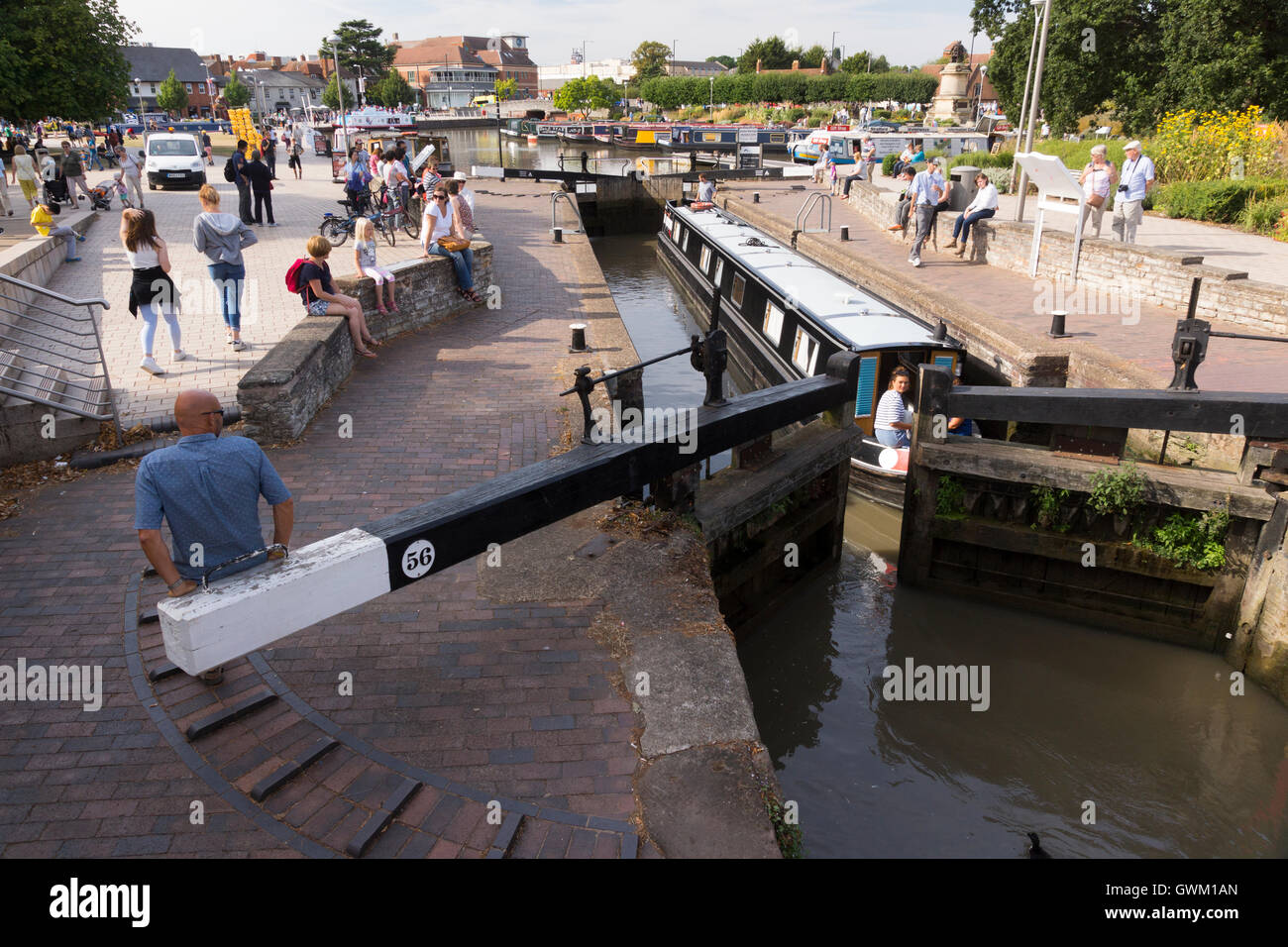 A man pushing open a lock gate on the Stratford Canal, Stratford upon ...