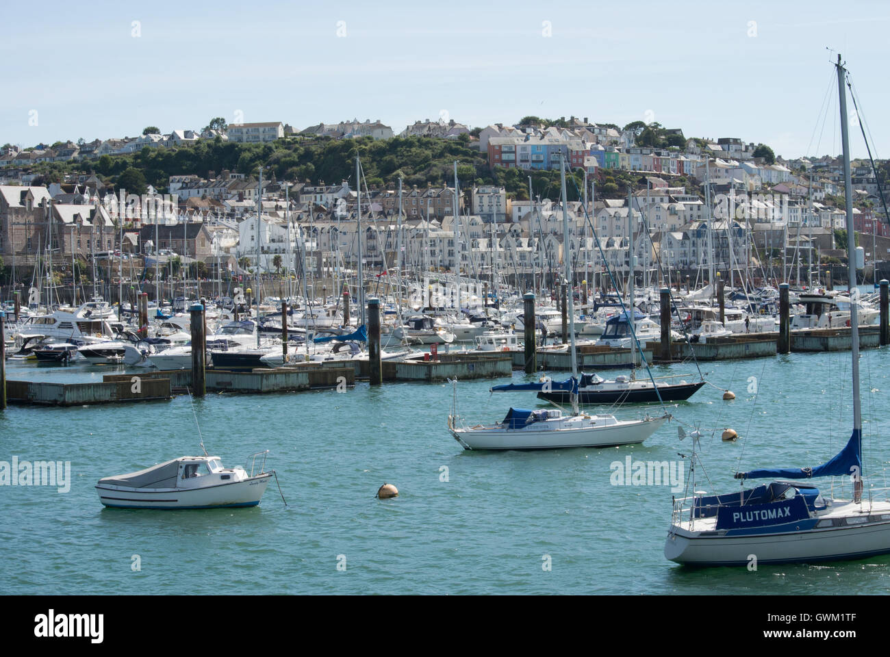 Brixham harbor viewed from the outer wall on a summers day Stock Photo ...