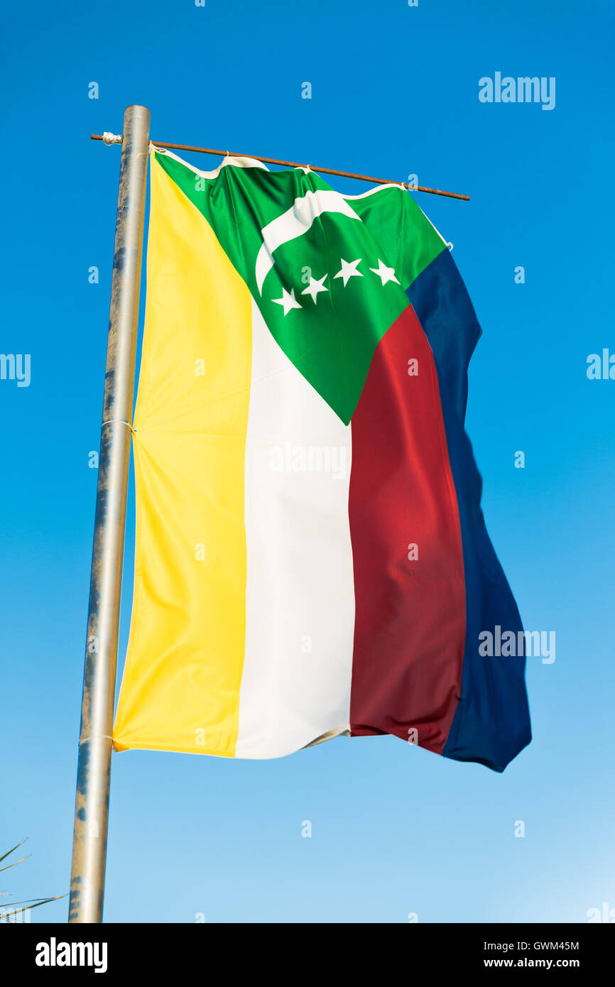 National flag of Comoros on flagpole Stock Photo - Alamy