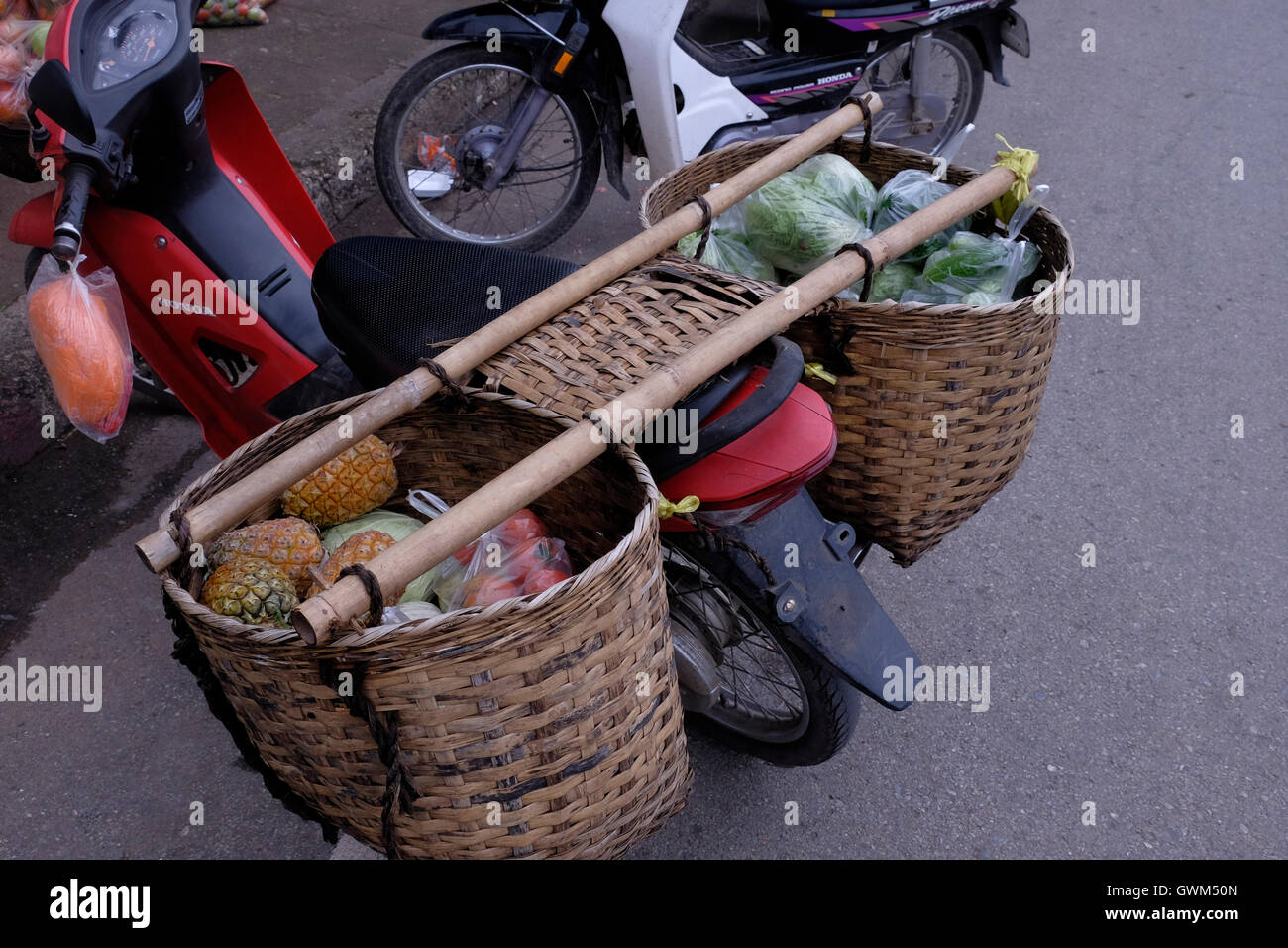 Baskets filled with food on a motorcycle in Mae Hong Son, a remote ...