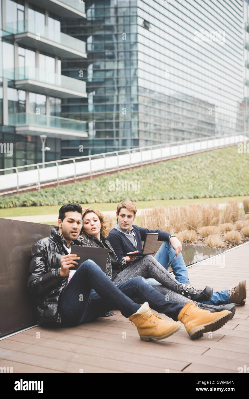 Multiracial business people working outdoor in town connected with ...