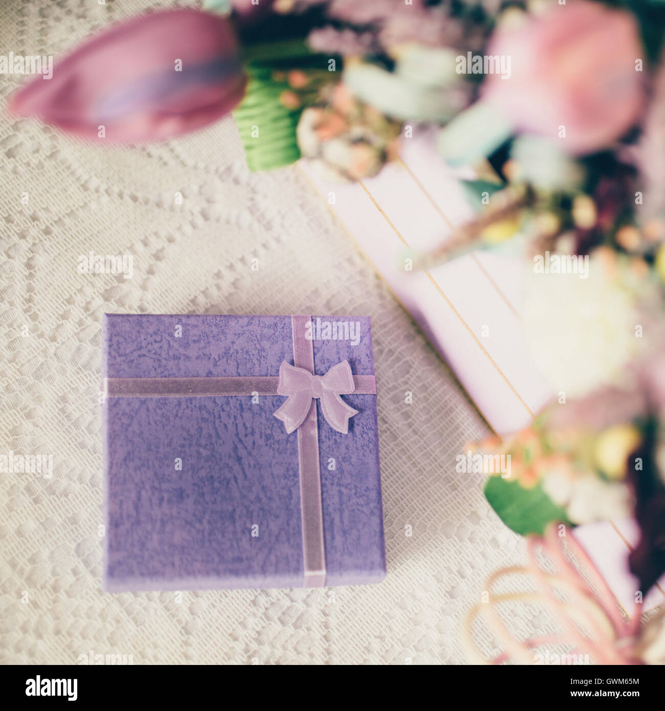 beautiful purple box for a gift in flowers Stock Photo - Alamy