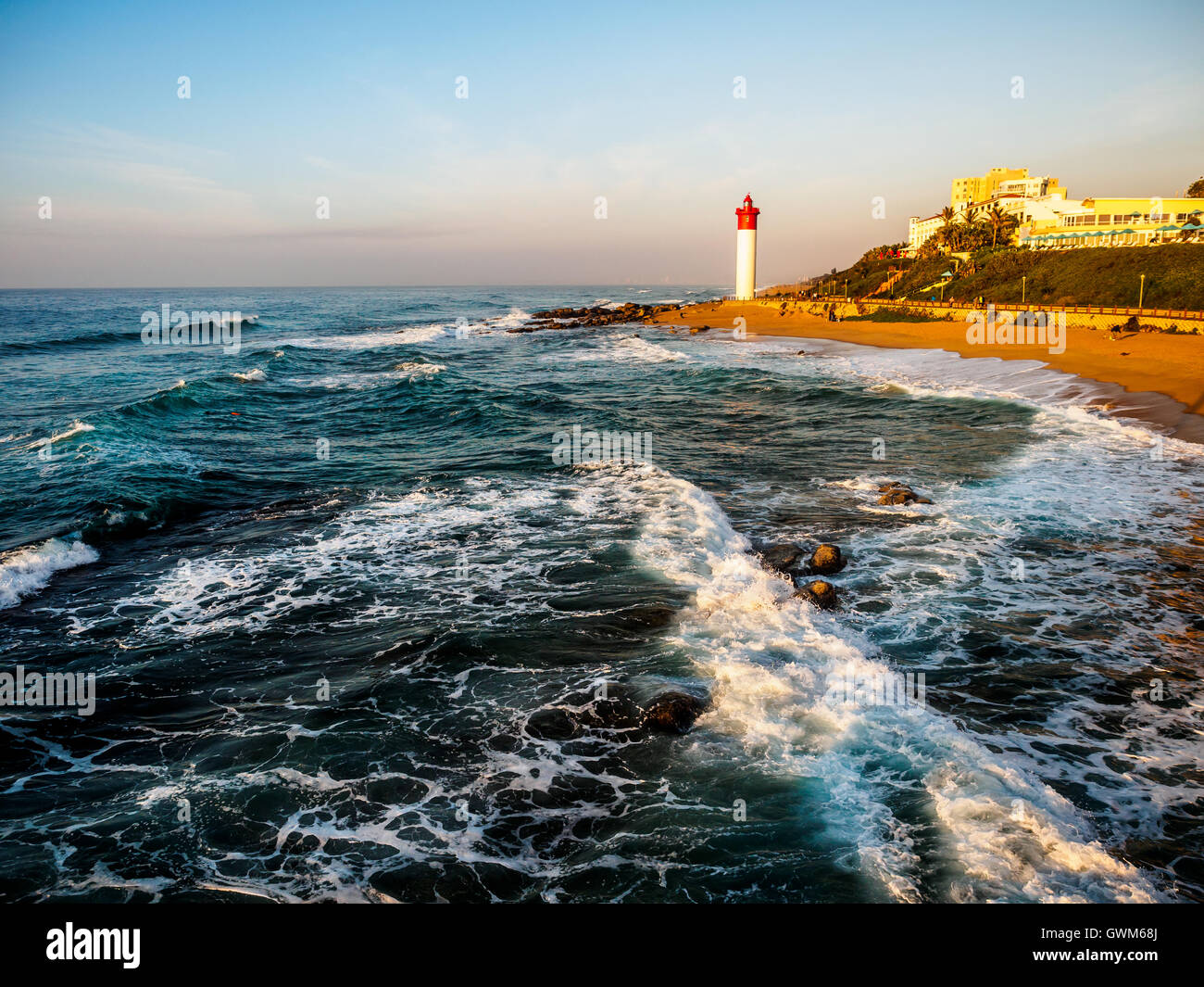 Waves roll onto golden beaches at sunrise in Umhlanga Rocks area of ...