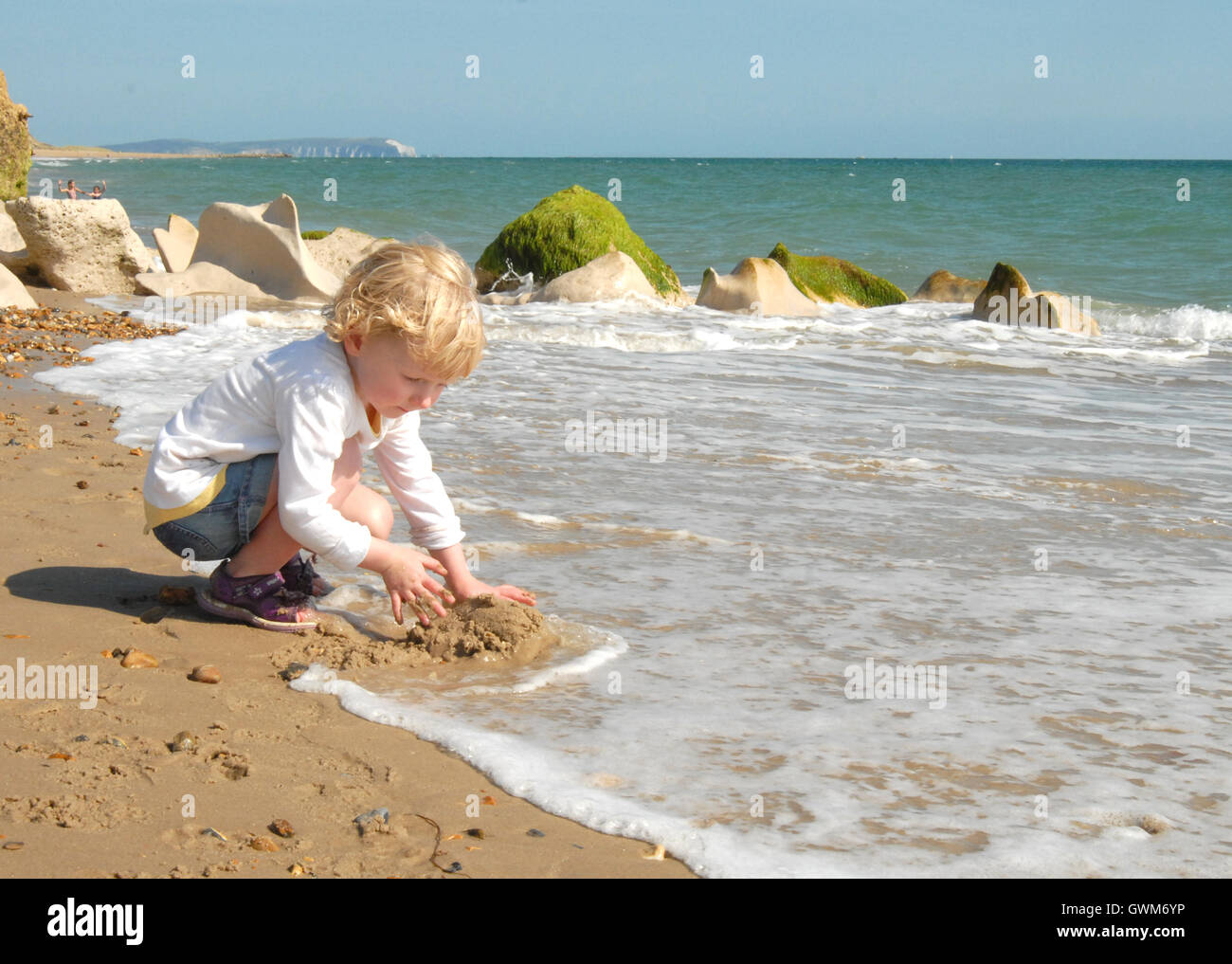 Child playing at beach hi-res stock photography and images - Alamy
