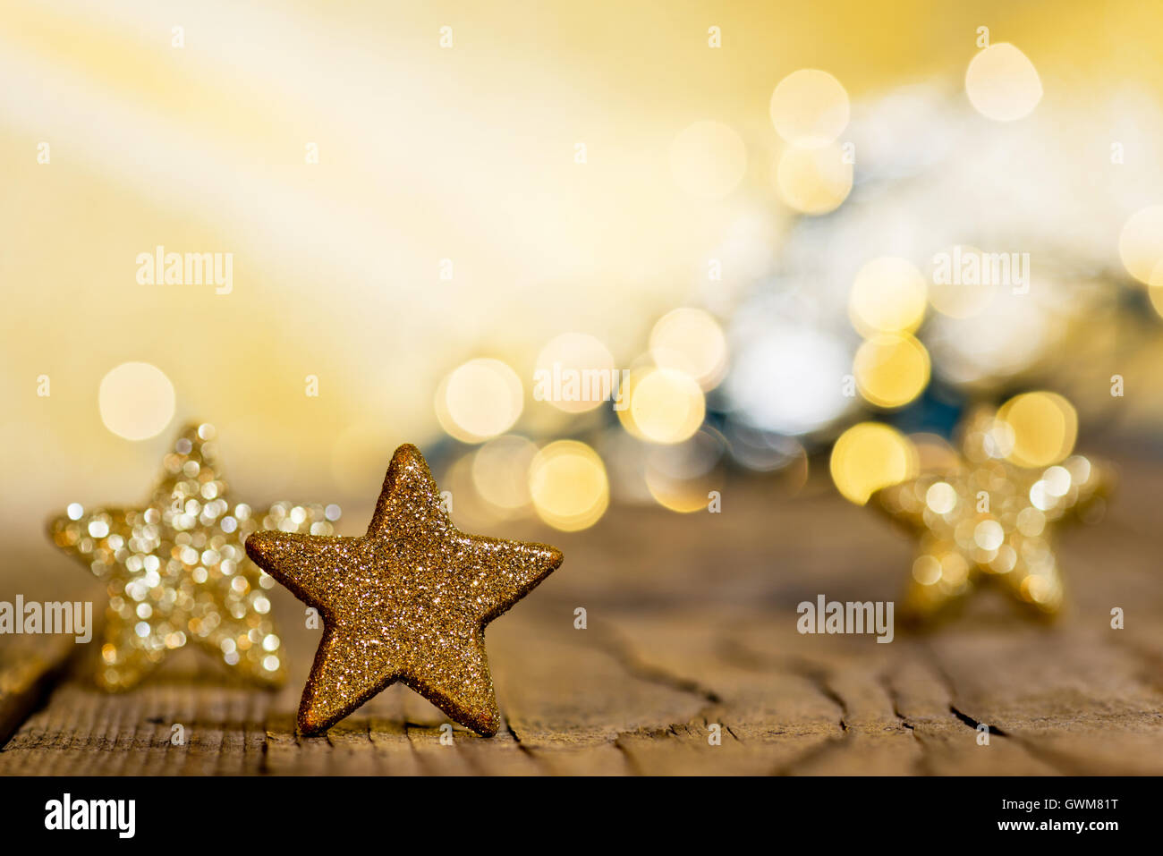 Christmas background with three stars and glitter Stock Photo - Alamy