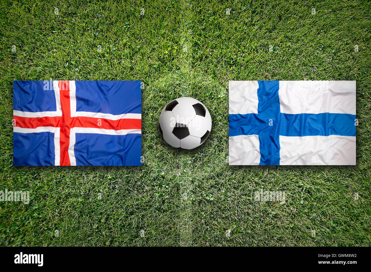Iceland and Finland flags on a green soccer field Stock Photo - Alamy