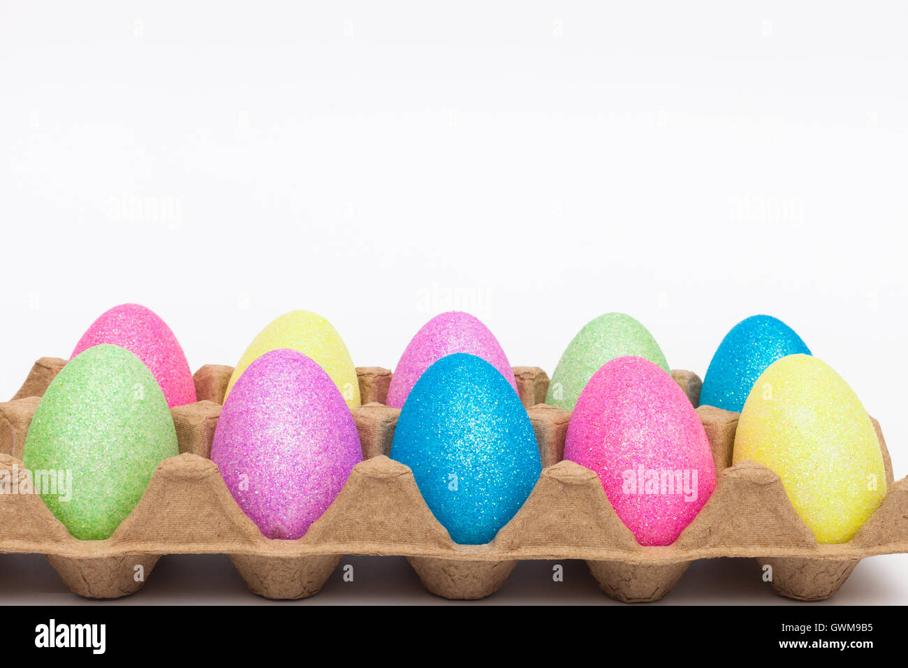 Glitter covered fake Easter eggs in an egg carton Stock Photo - Alamy