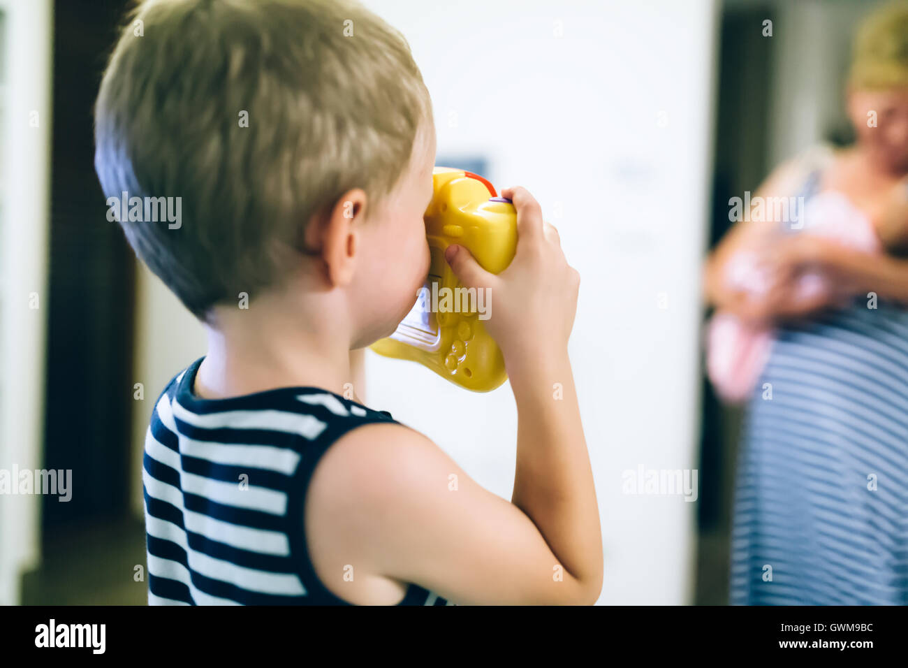 Cute boy wants to become photographer Stock Photo - Alamy