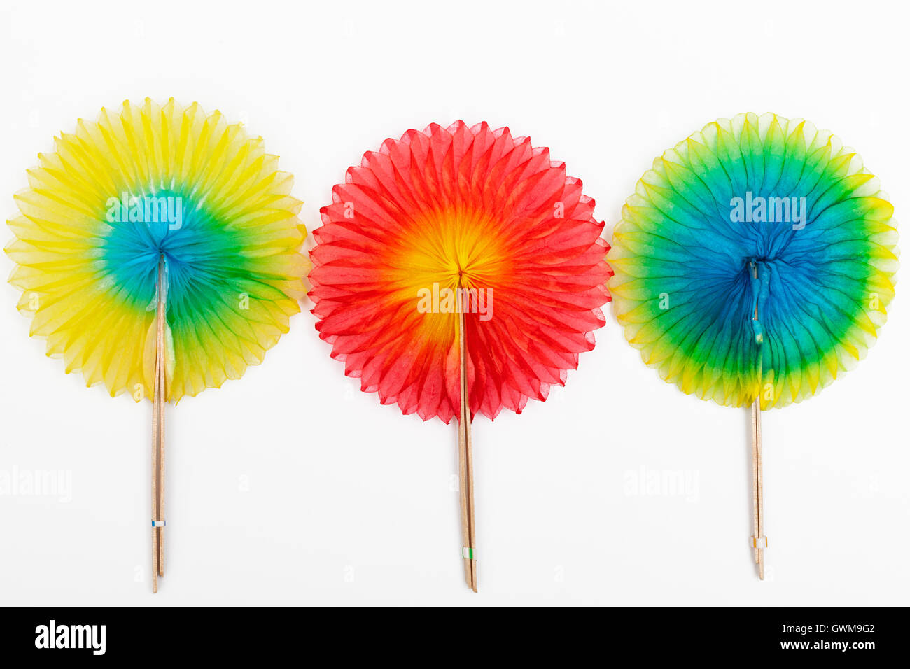 Three colorful tissue paper cocktail fans on a white background Stock ...