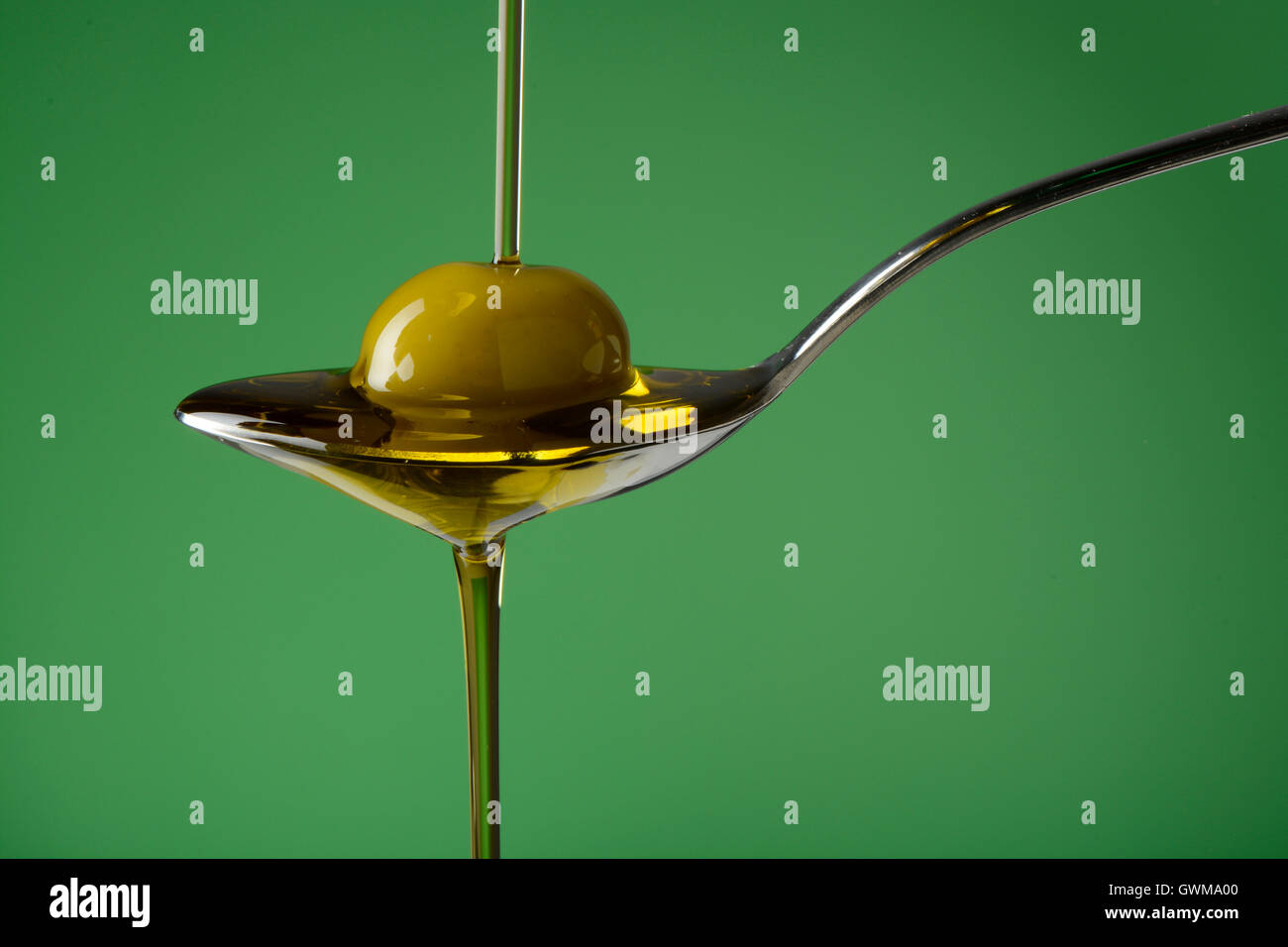 Olive oil in spoon hi-res stock photography and images - Alamy