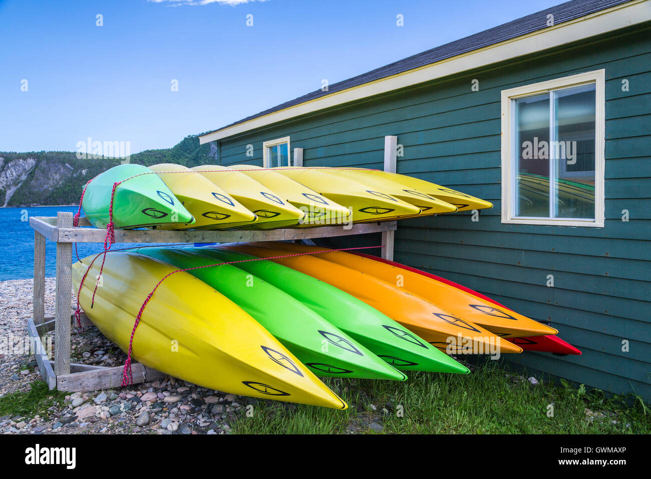 Colorful kayaks and fishing stages at Norris Point, Gros Morne National ...