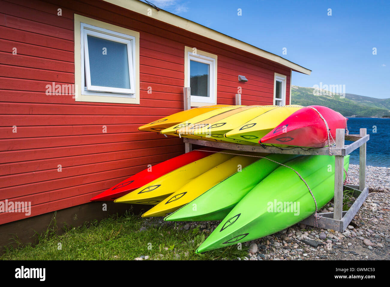 Colorful kayaks and fishing stages at Norris Point, Gros Morne National ...