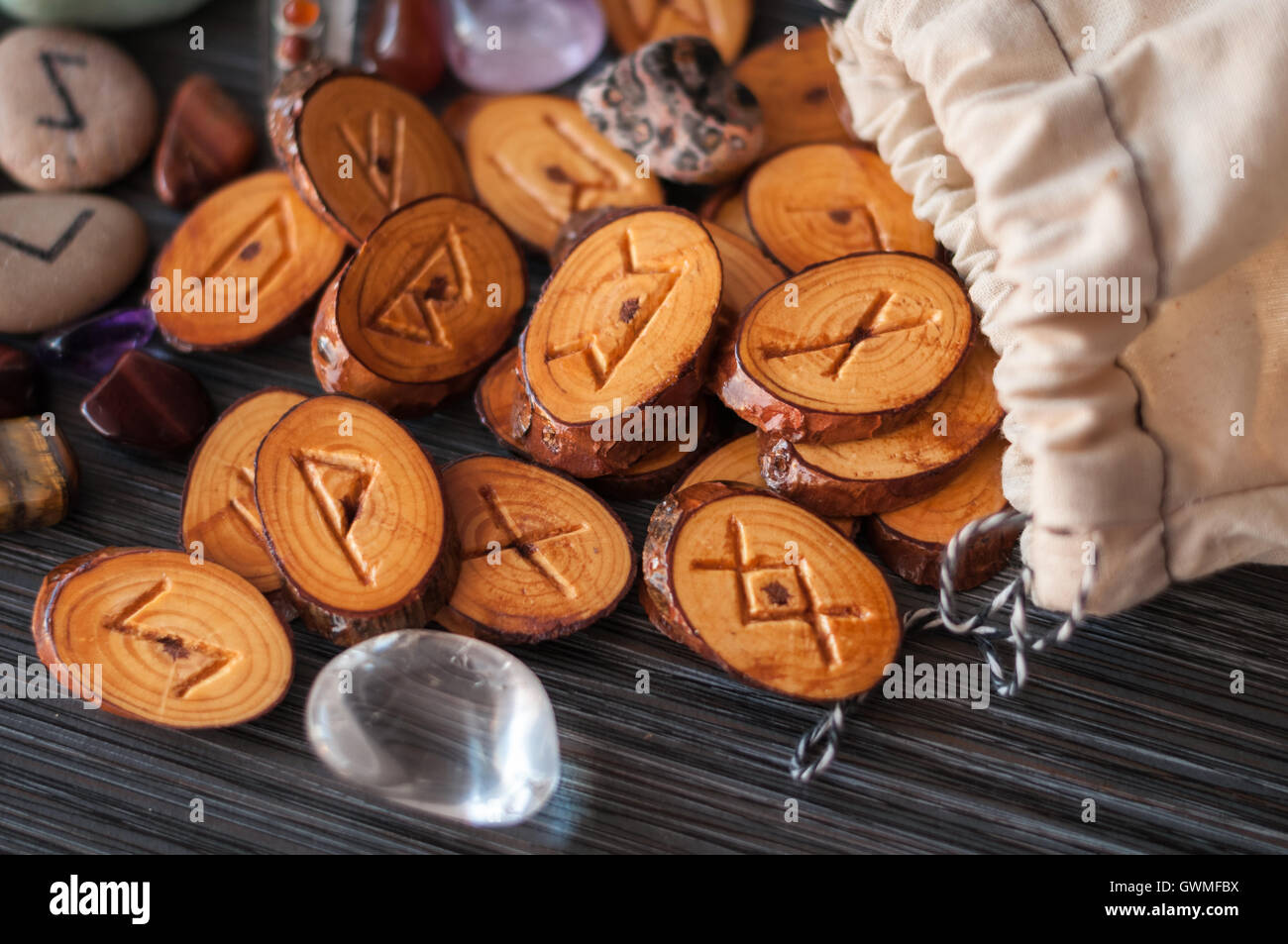 on a dark background from the rag bag spilled a few wooden runes Stock ...