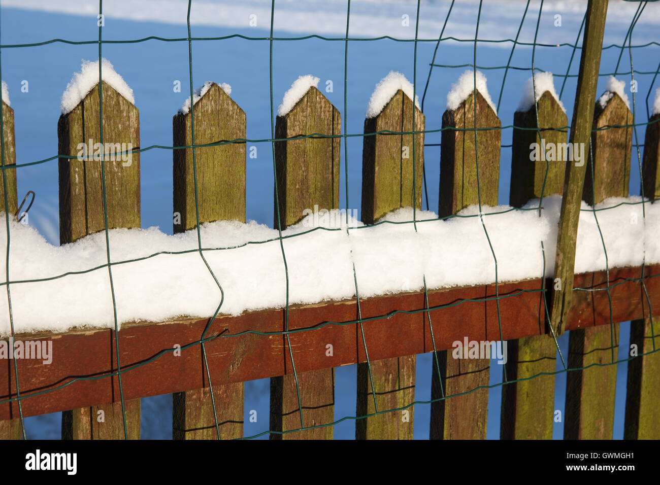 Snow covered fence Stock Photo - Alamy