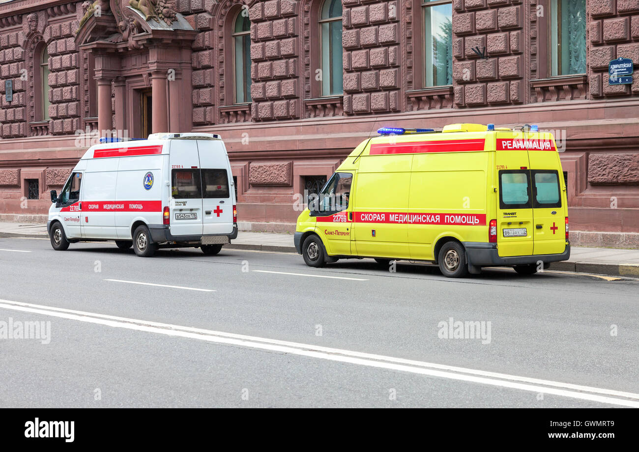 Emergency ambulance cars with blue flashing light on the roof parked up on the city street Stock ...