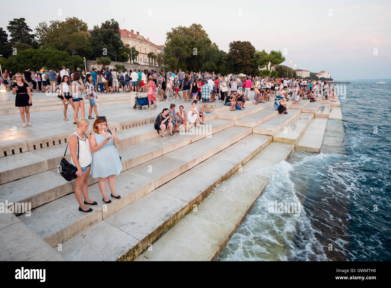 ZADAR, CROATIA - SEPTEMBER 1, 2016: People visit famous sea organ and ...