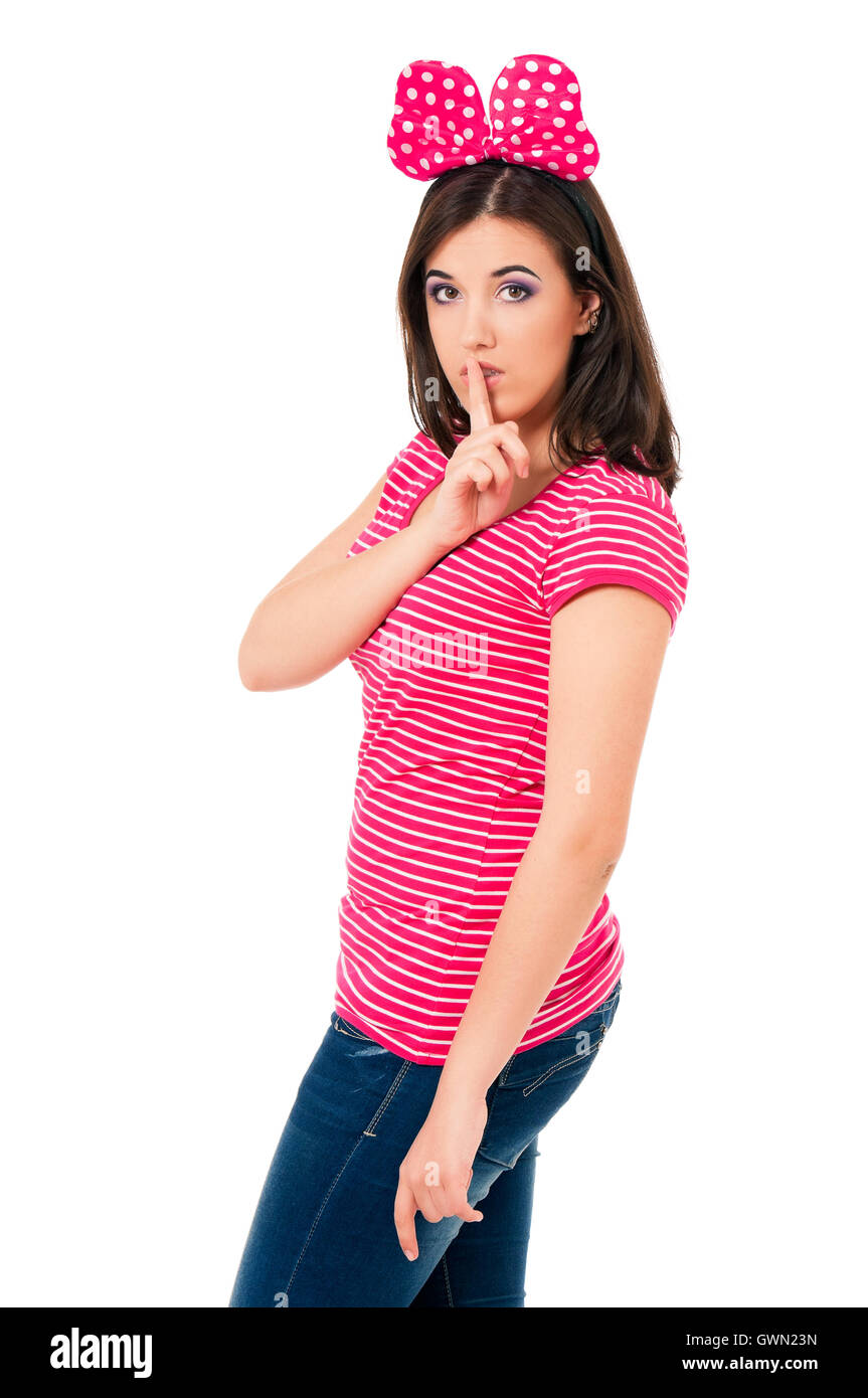 Girl making silence gesture Stock Photo - Alamy