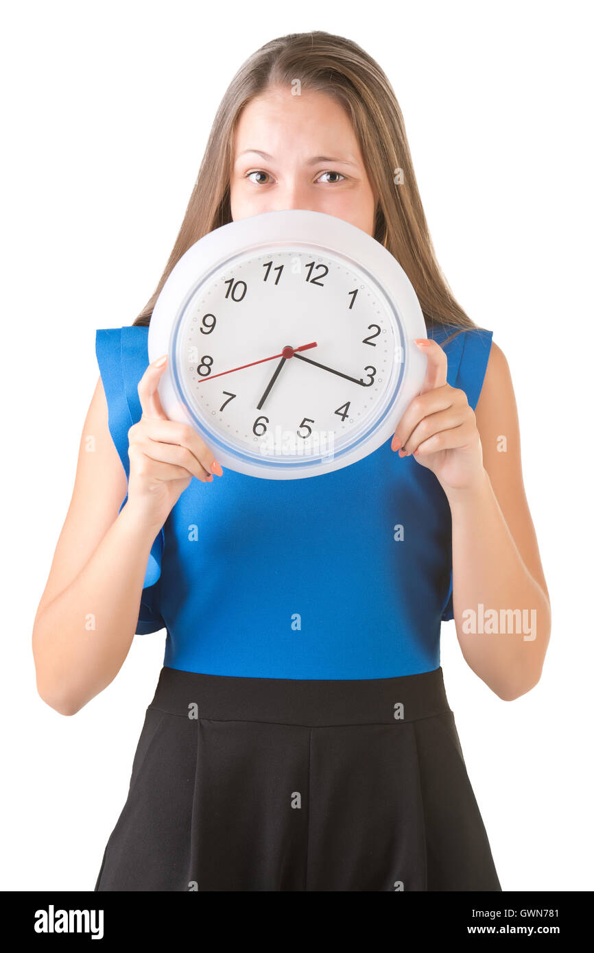 Woman hiding behind alarm clock. Isolated in white Stock Photo - Alamy