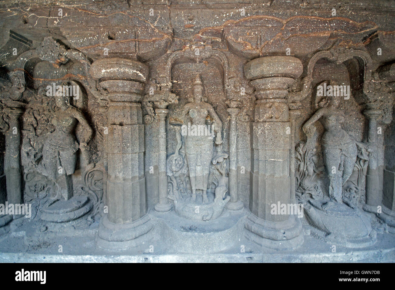Religious images carved into solid rock inside an ancient Hindu cave ...
