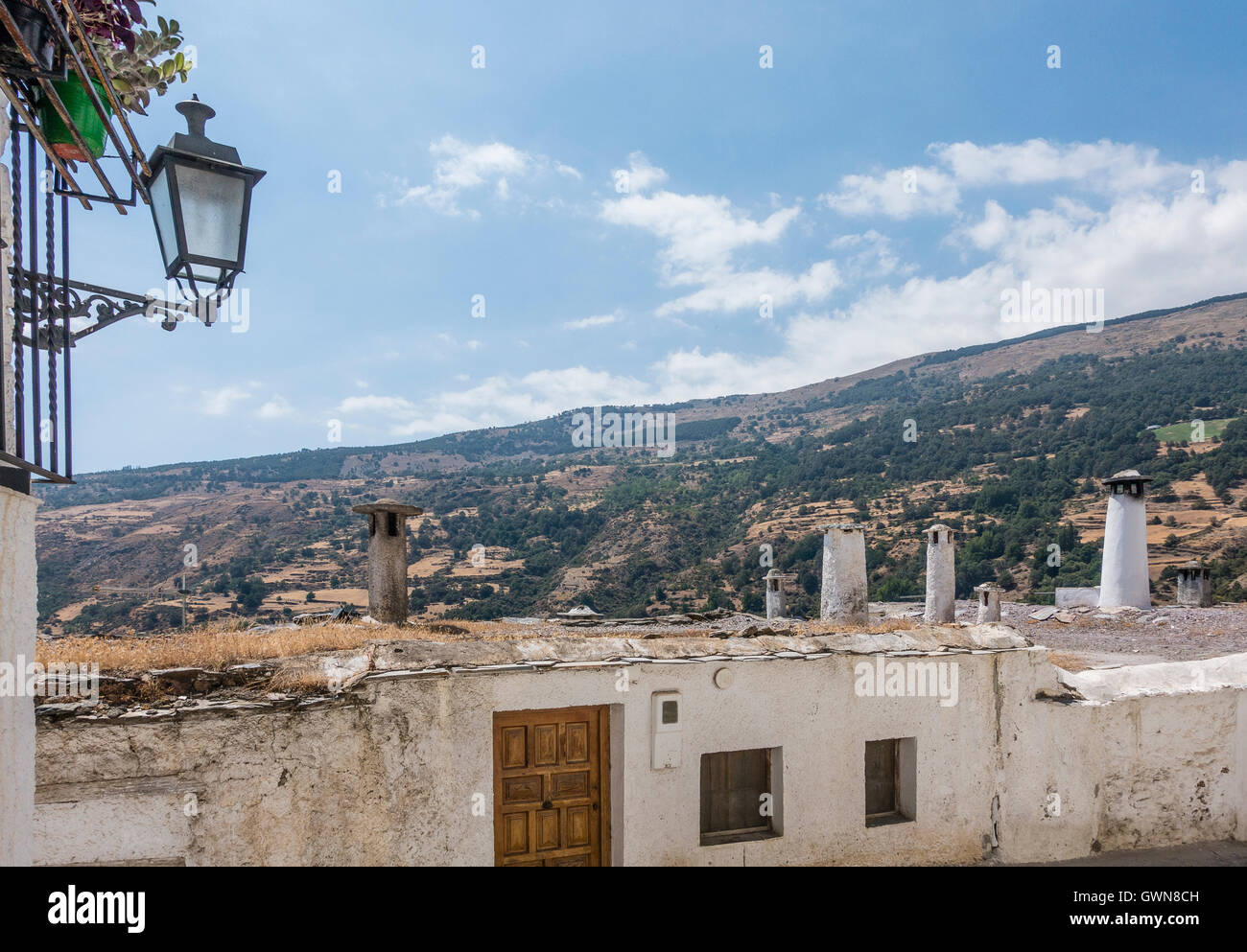 Unique chimneys of Capileira, Spain, a "white village Stock Photo - Alamy