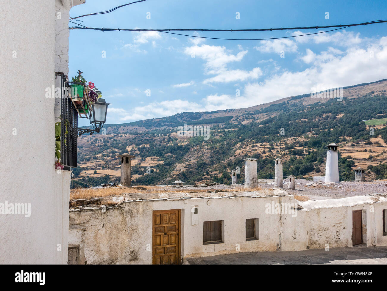 Unique chimneys of Capileira, Spain, a "white village Stock Photo - Alamy