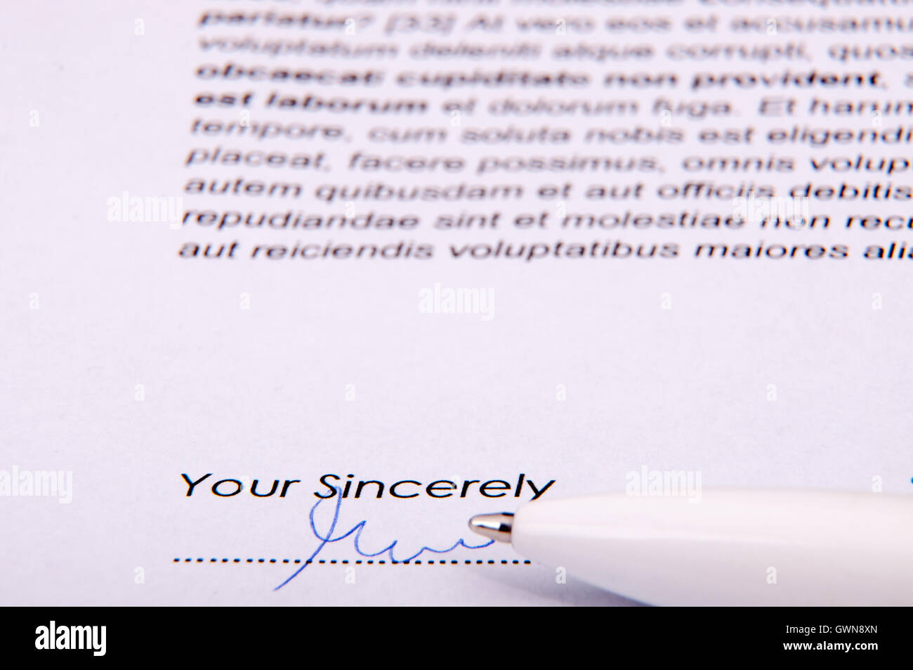 Signature over agreement Stock Photo - Alamy