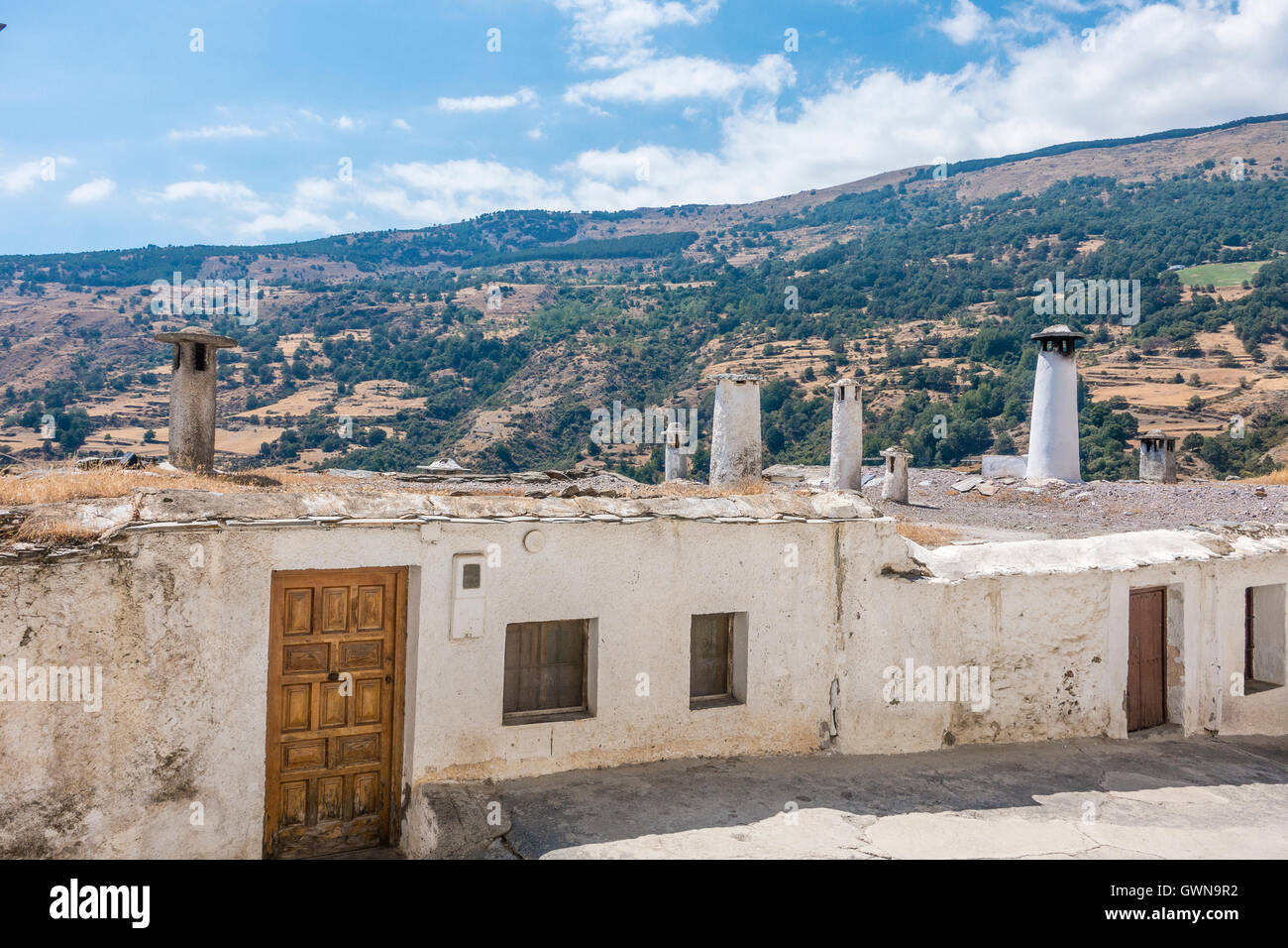 Unique chimneys of Capileira, Spain, a "white village Stock Photo - Alamy