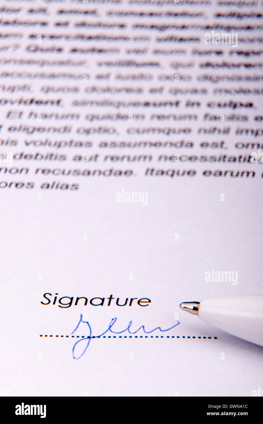 Signature over agreement Stock Photo - Alamy