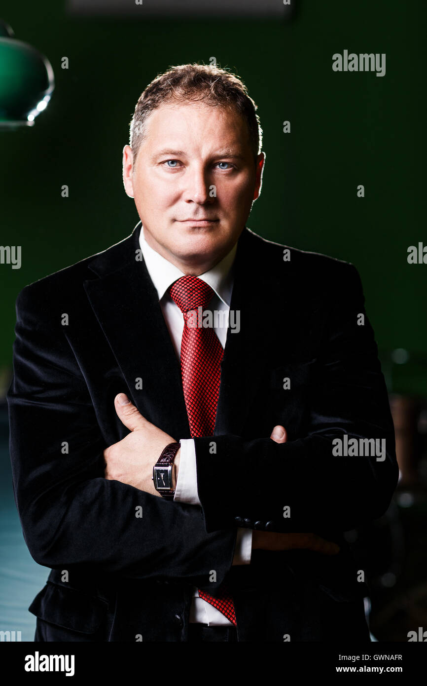 Portrait of a serious middle age businessman Stock Photo - Alamy