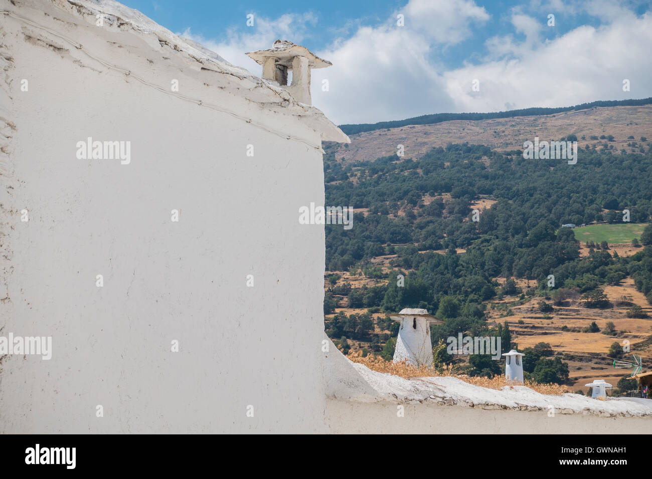 Unique chimneys of Capileira, Spain, a "white village Stock Photo - Alamy