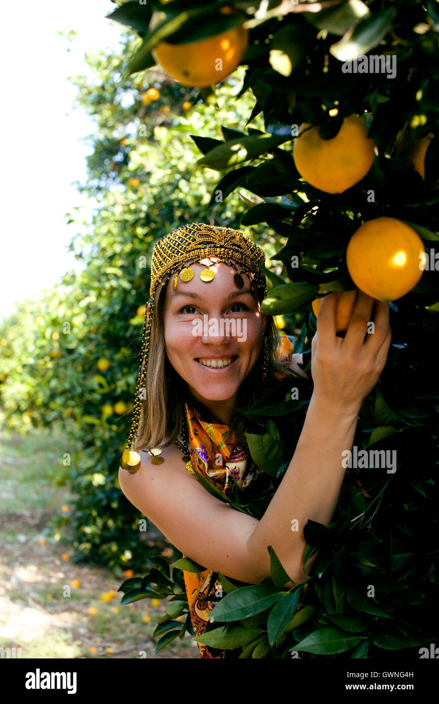 pretty islam woman in orange grove smiling, real muslim girl cheerful ...