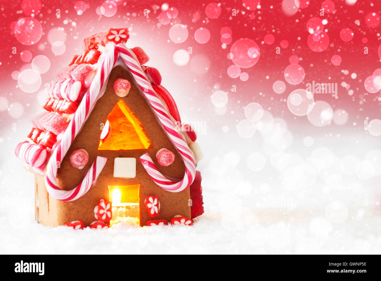 Gingerbread House, Red Background With Bokeh And Snowflakes, Copy Space ...